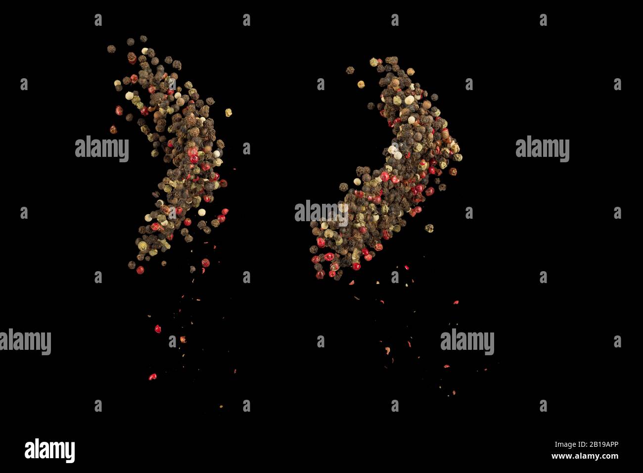 Whole coloured pepper spice flying in the air. Zero gravity concept ...