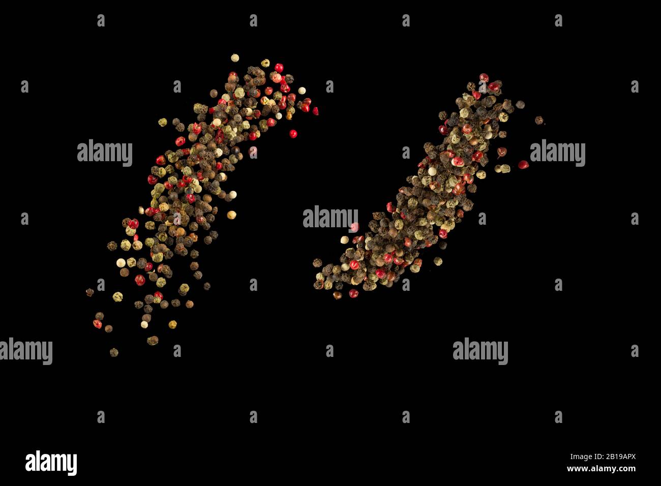 Whole coloured pepper spice flying in the air. Zero gravity concept ...