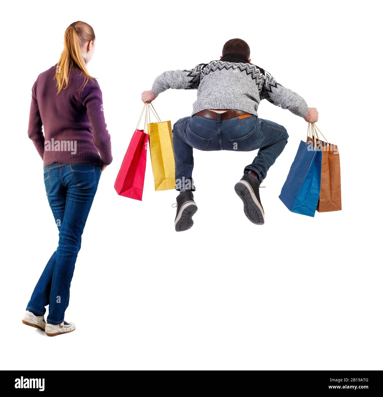 back view of couple with shopping bags. backside view of person. Rear ...