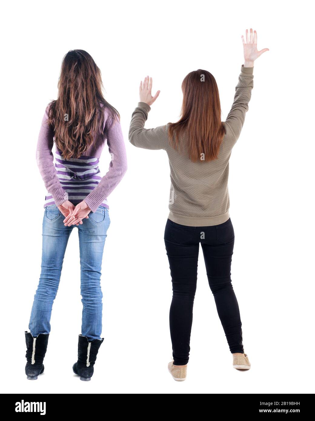 Back view of two woman in sweater. Rear view people collection ...