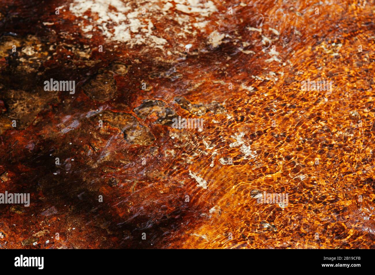 Rough dark grainy natural red brown sand stone texture background with ...