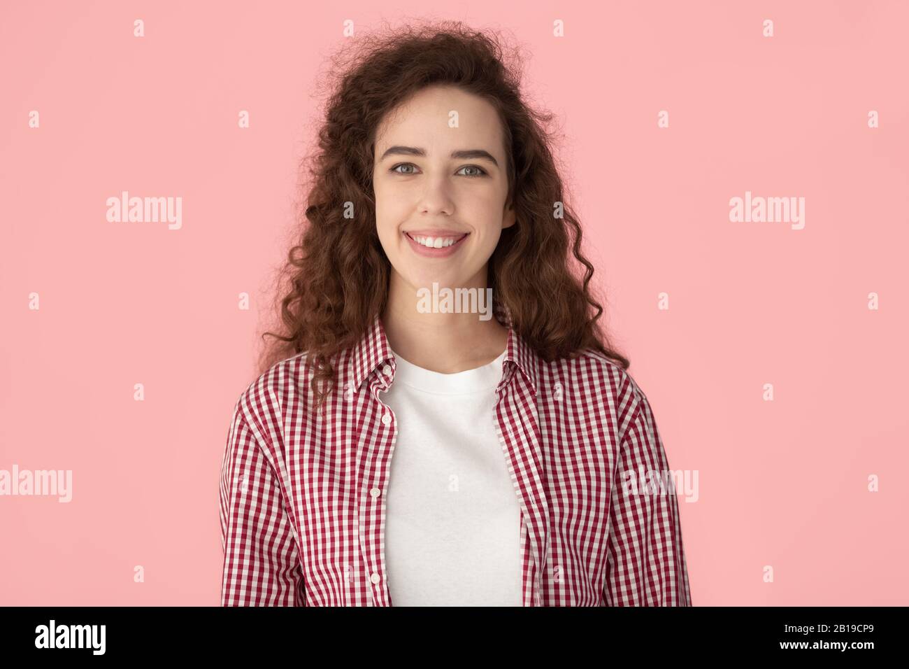 Happy smiling sincere millennial curly woman head shot portrait Stock ...