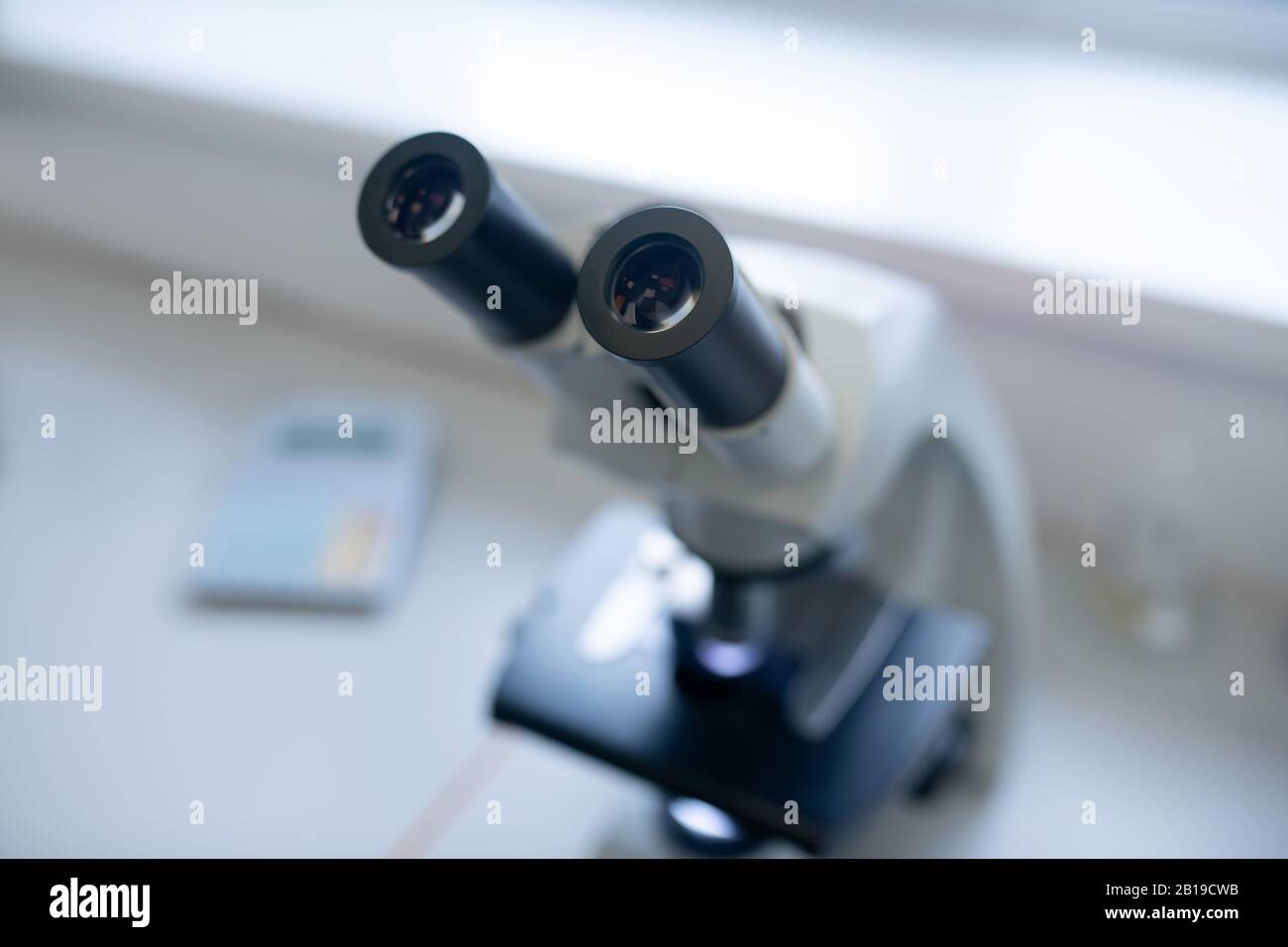 Close up picture of a microscope on the table Stock Photo - Alamy