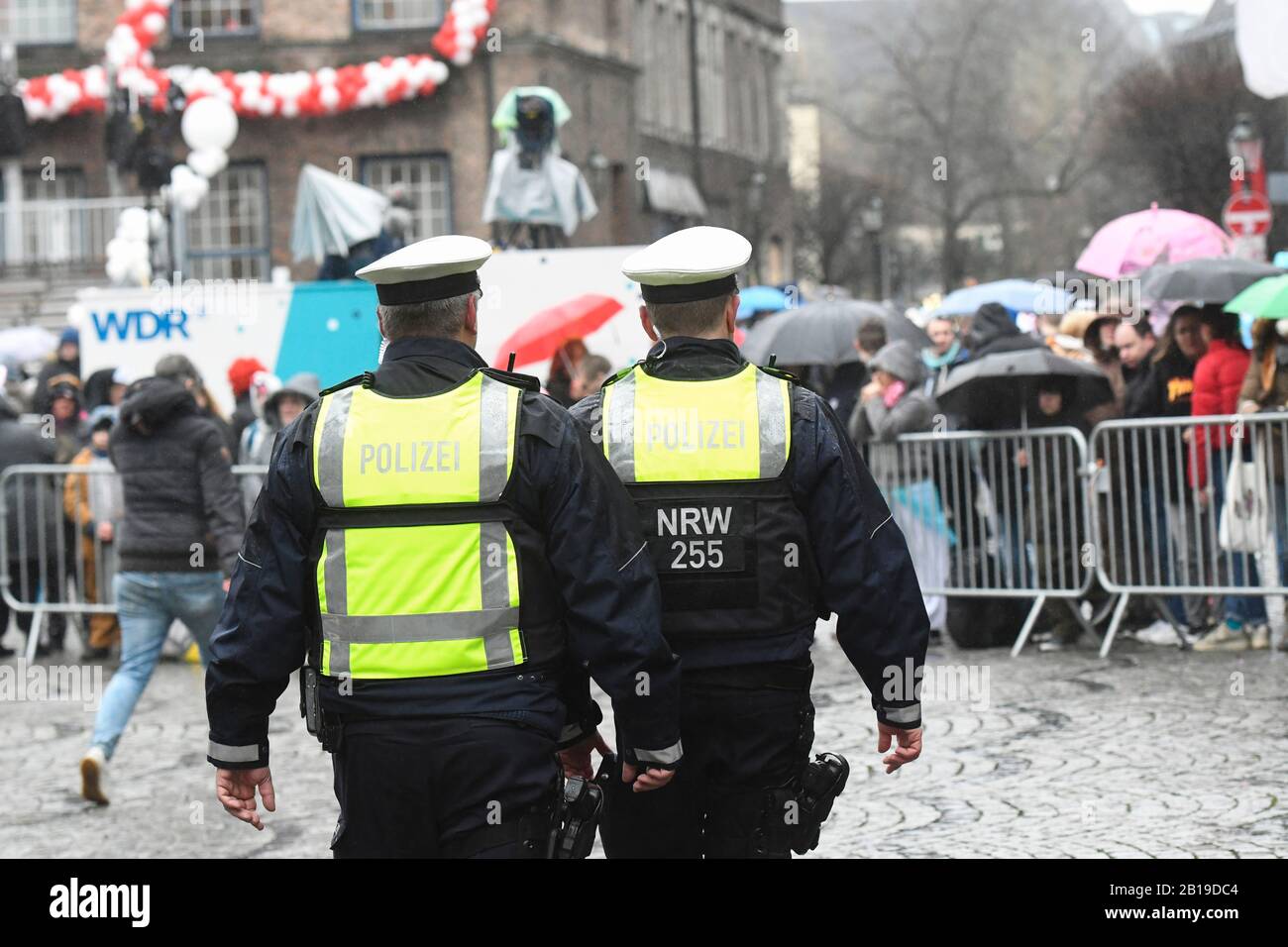 Duesseldorf, Germany. 24th Feb, 2020. Policemen walk the cordoned-off ...