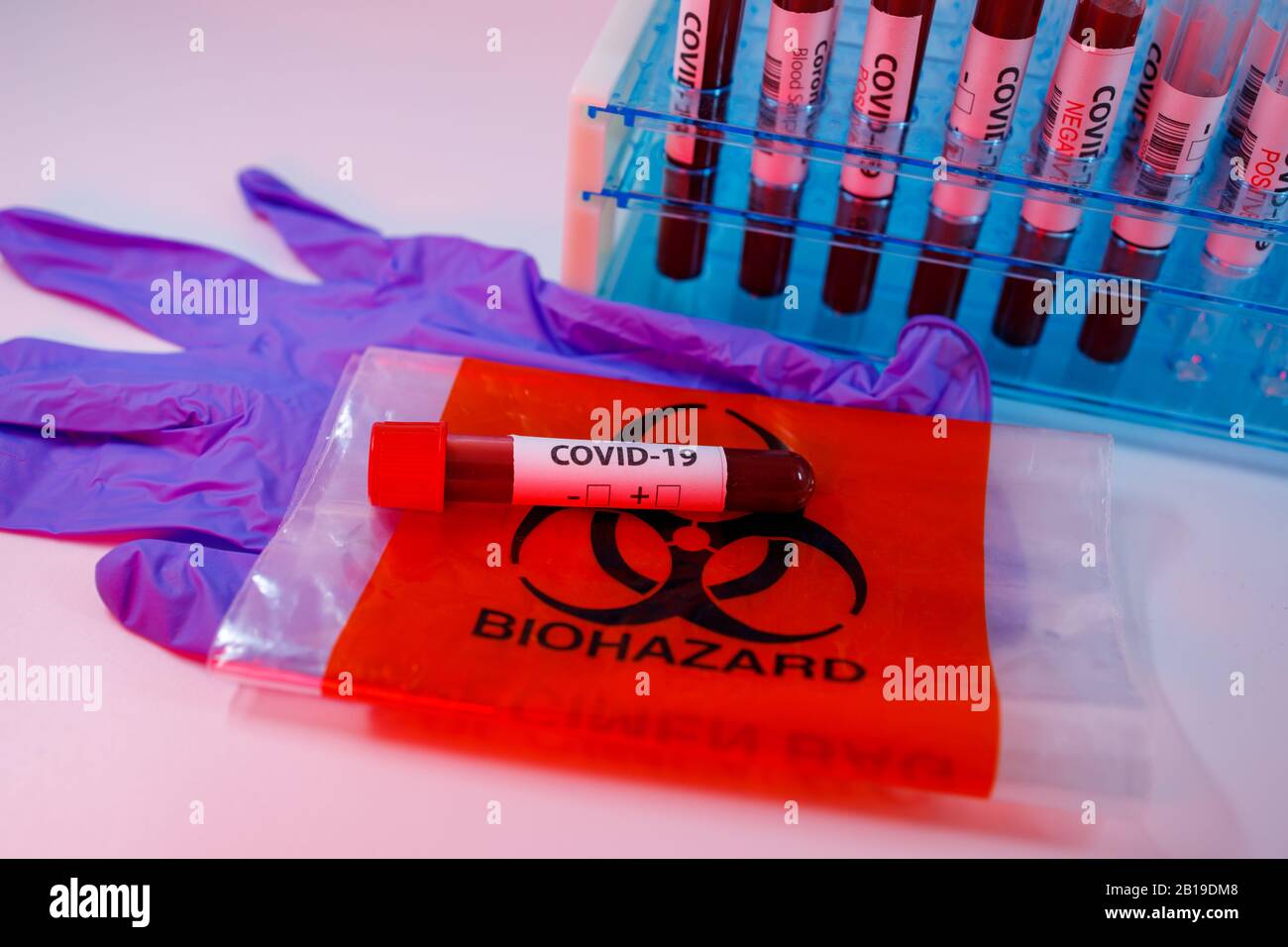 Test tube for covid-19 on a biohazard transportation bag and a blue ...