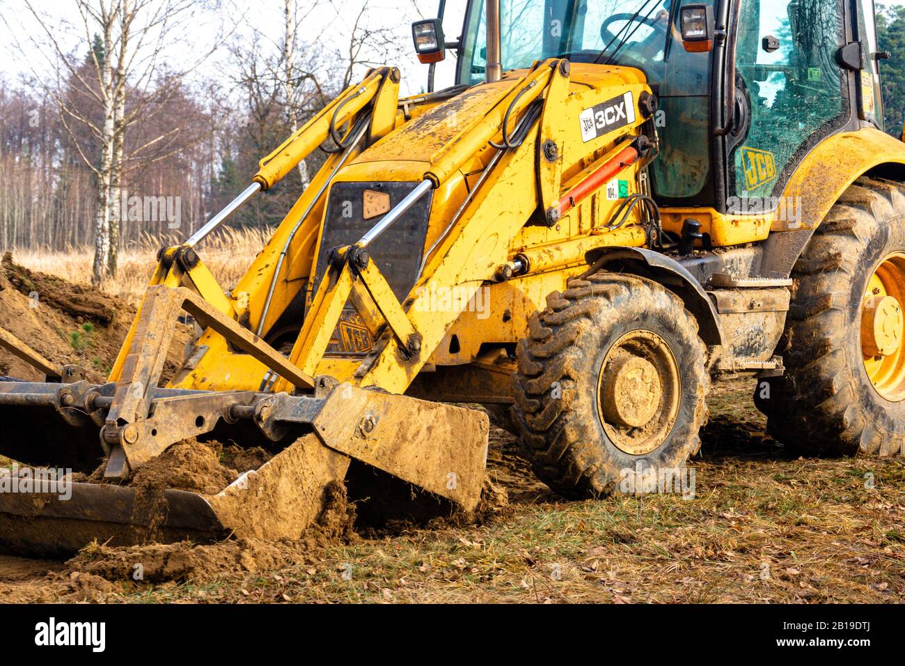 Backhoe grading hi-res stock photography and images - Alamy
