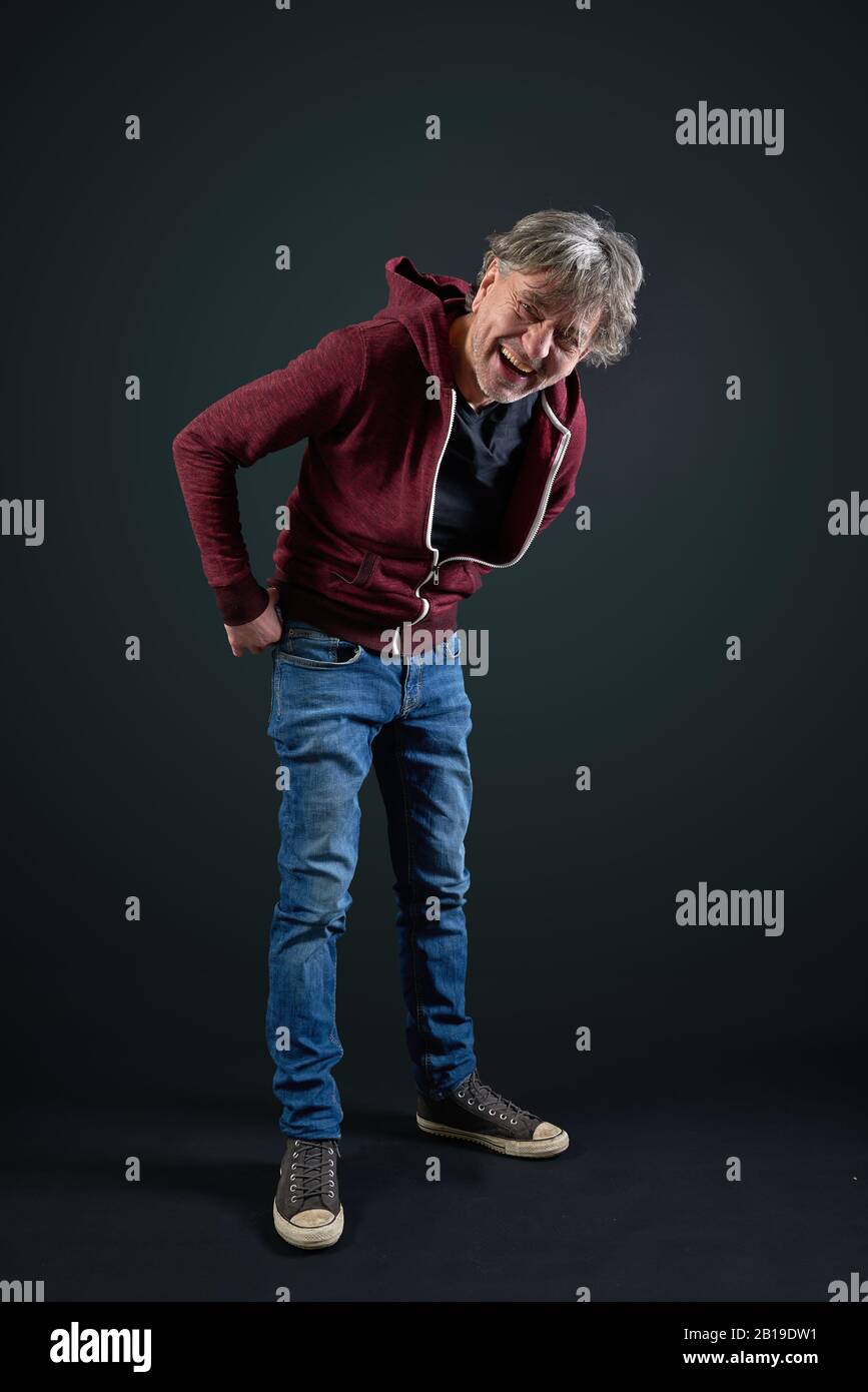 Portrait of a man with a red jacket on gradient background Stock Photo ...