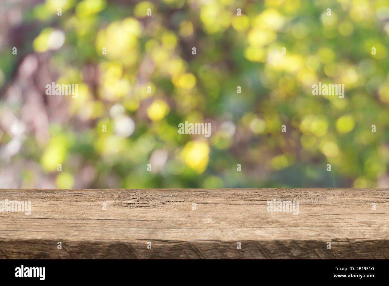 Empty brown wooden table and beautiful garden on a background Stock ...