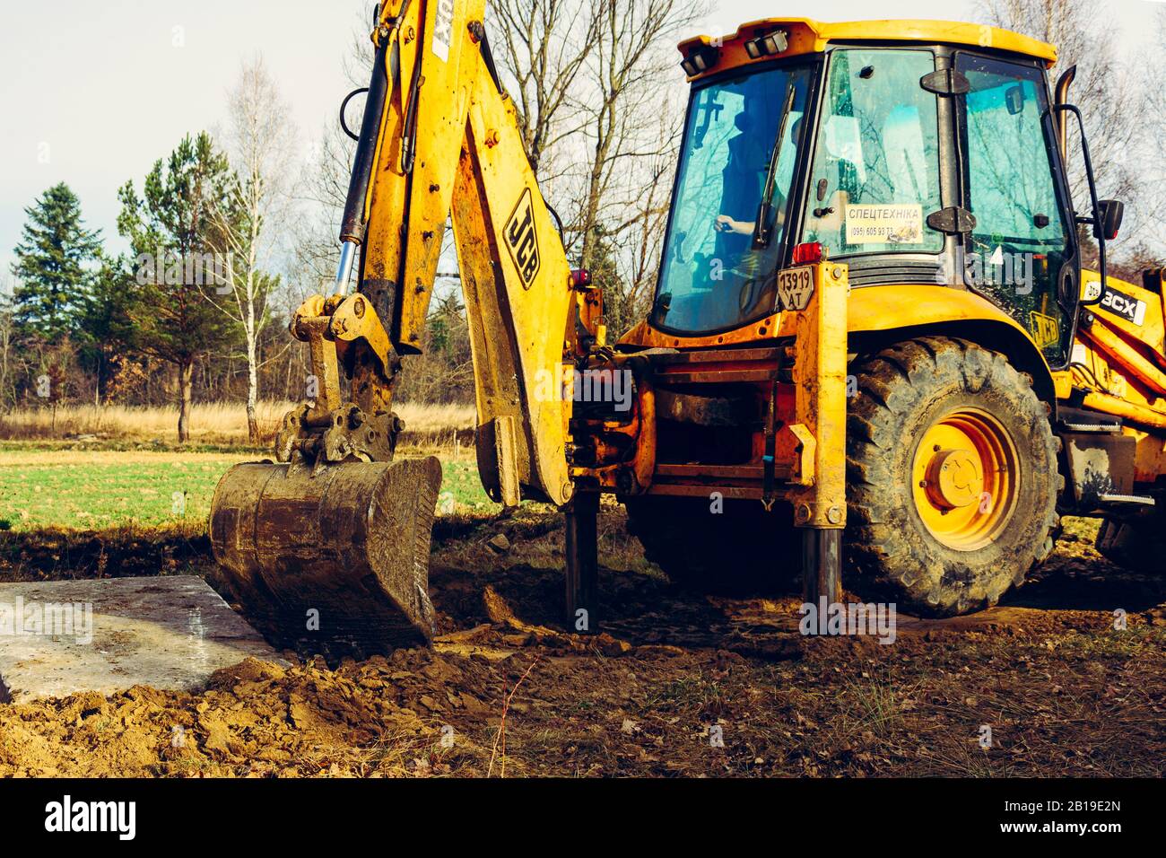 Trostyanets, Ukraine December 20: excavator transports concrete slabs ...