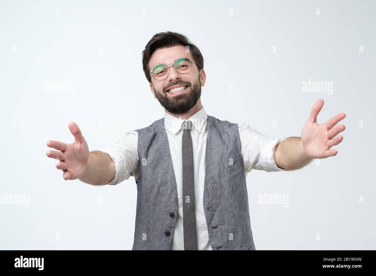 Free hugs for person who had bad day. Cheerfull hispanic male in ...