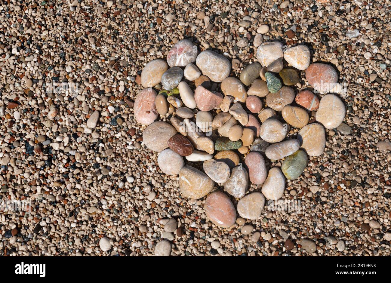Heart shape pebbles on texture hi-res stock photography and images - Alamy