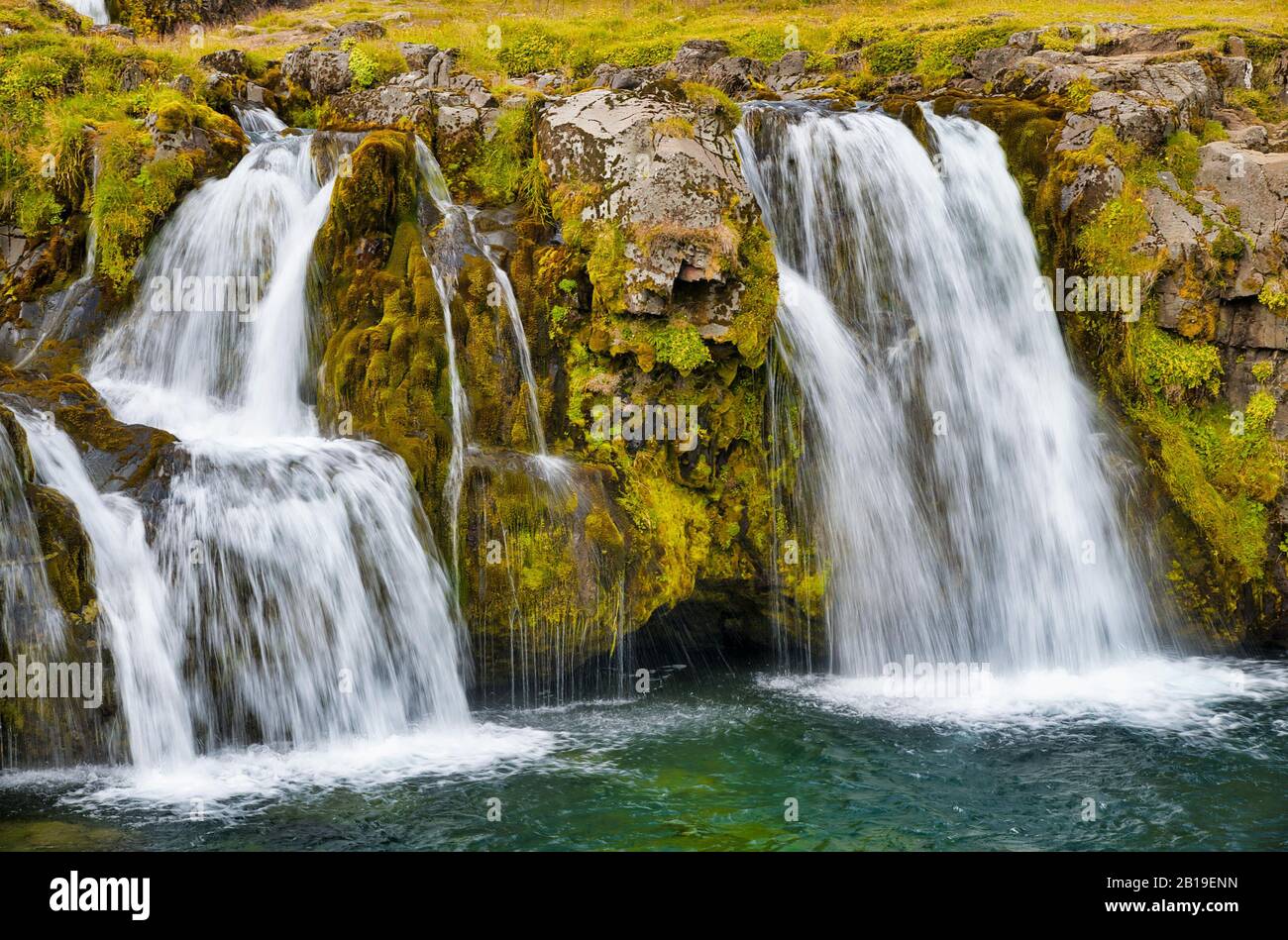 Kirkjufell waterfalls in summer season, Iceland Stock Photo - Alamy
