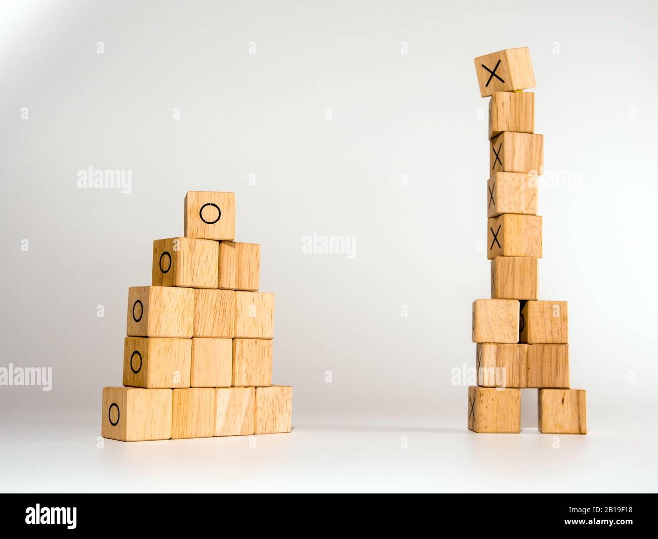 The stacks of different high rectangular wooden cubes to be two stacks ...