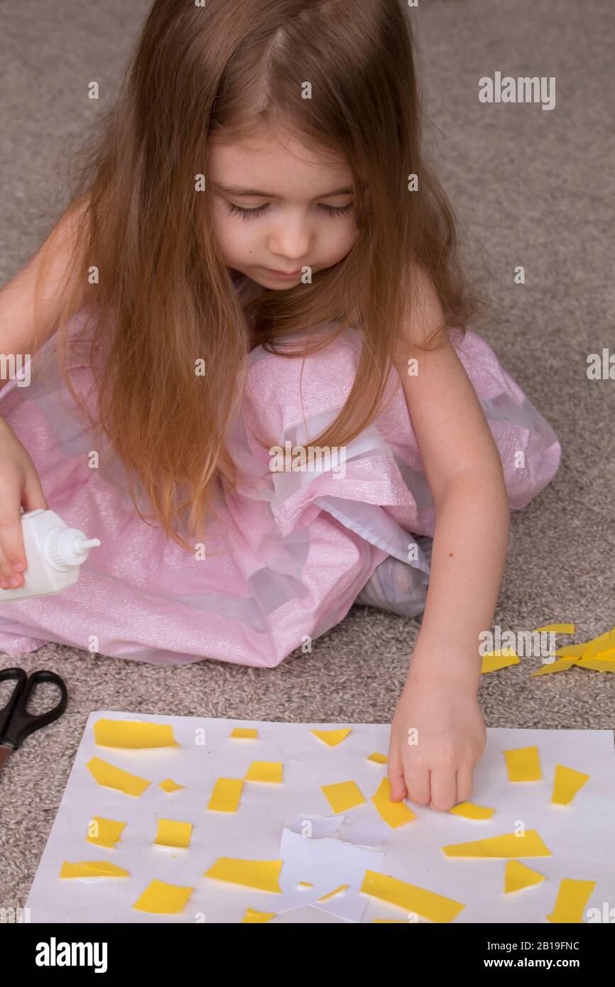 Cute little 4 years old girl making crafted applied ornament with ...