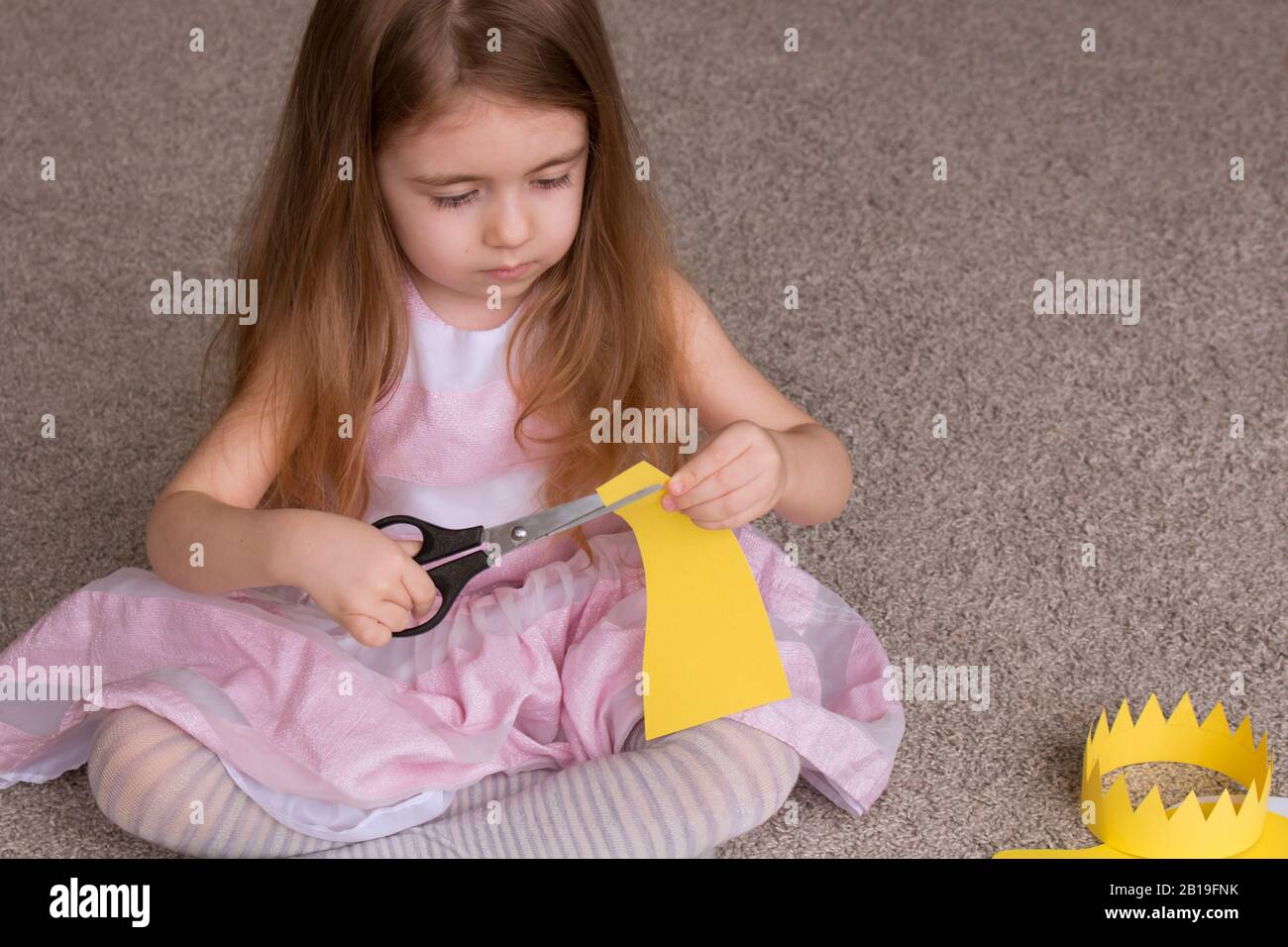 Cute little 4 years old girl making crafted applied ornament with ...