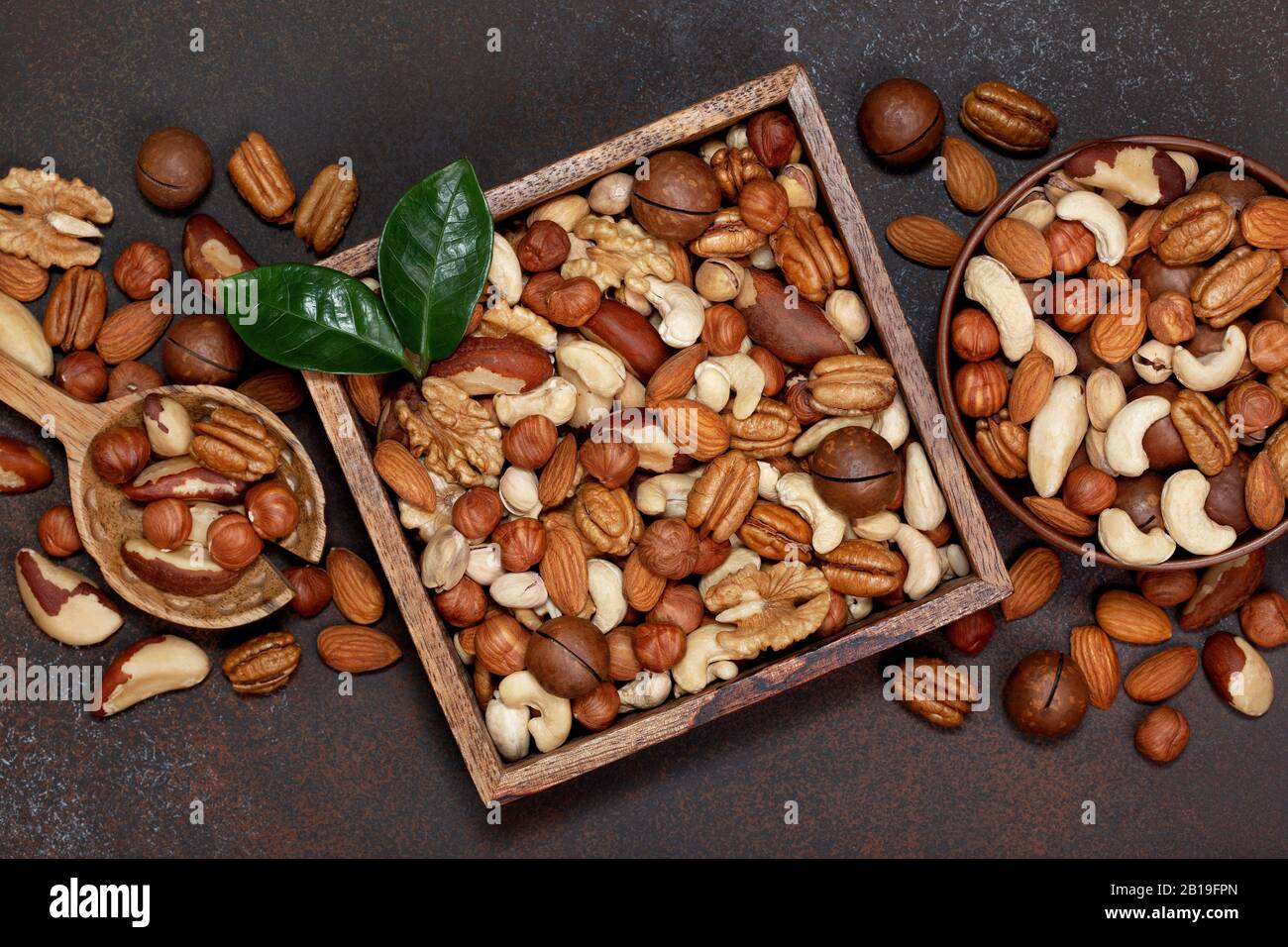 different types of nuts on a dark background. view from above Stock ...