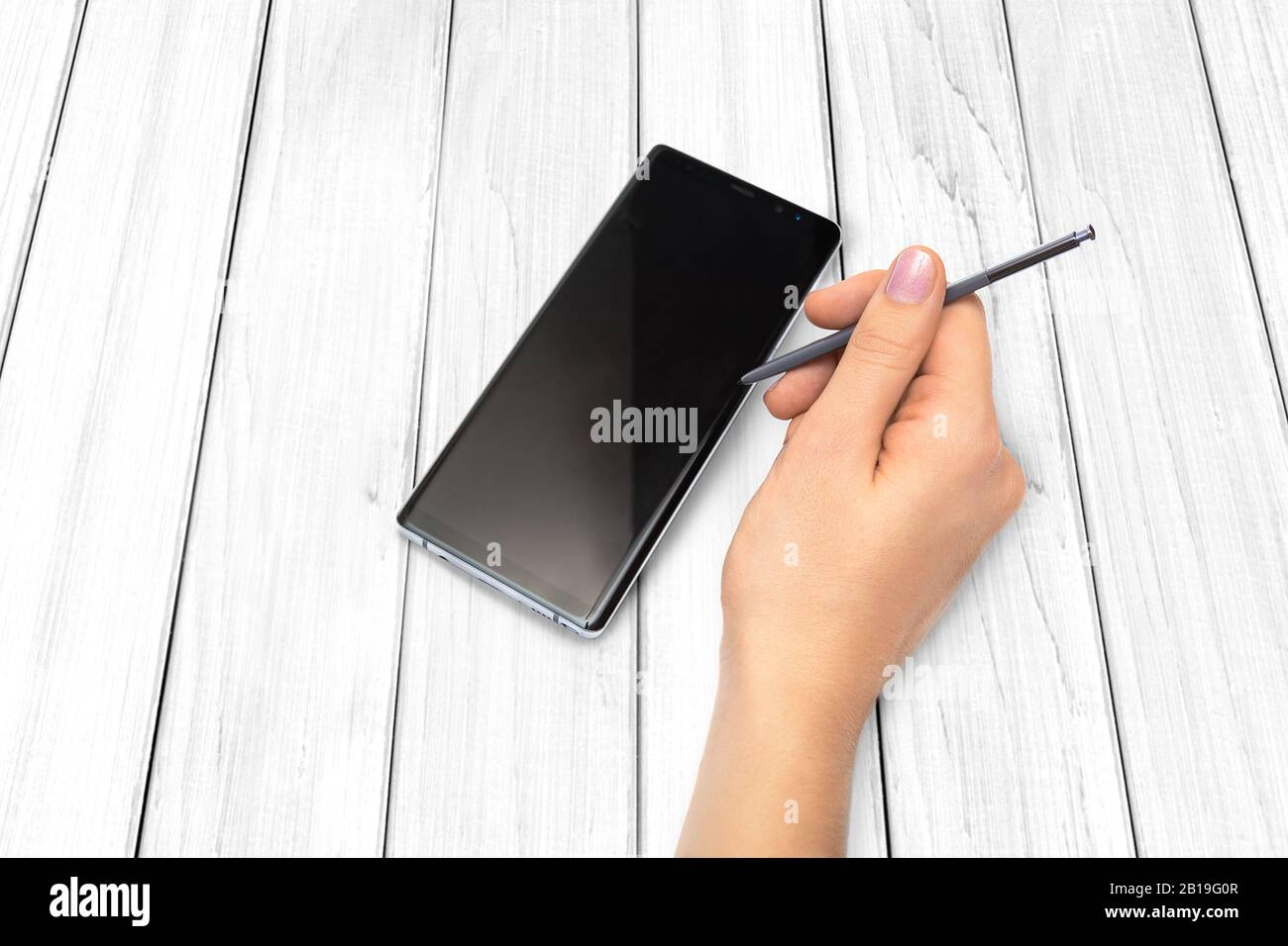 Human hands using smartphone and stylus Stock Photo - Alamy