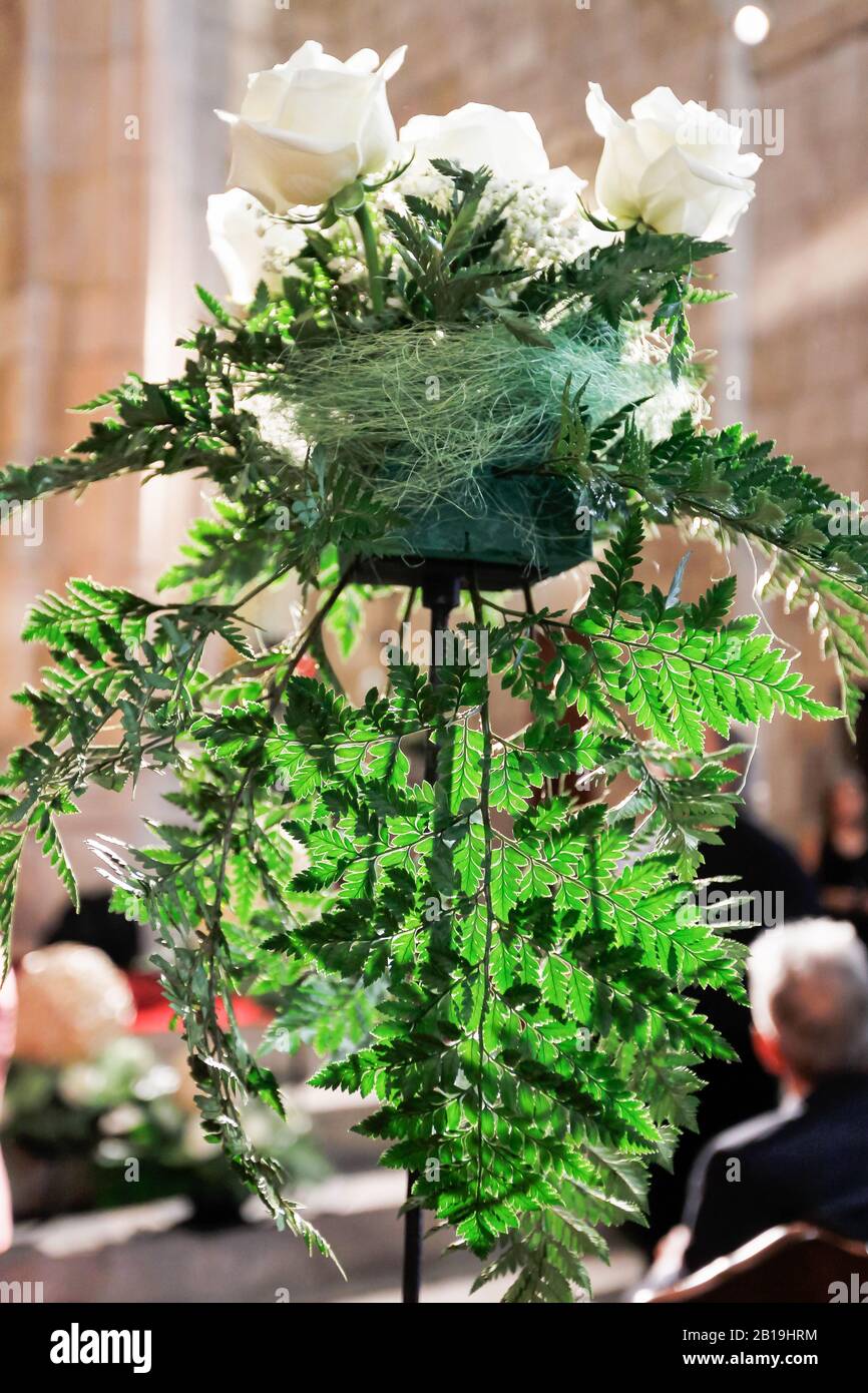 Decoration with fern leaves and white roses at a celebration inside a ...