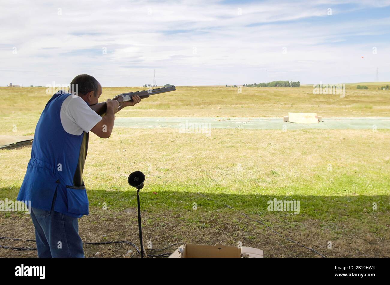 person with a rifle shooting outdoors Stock Photo - Alamy