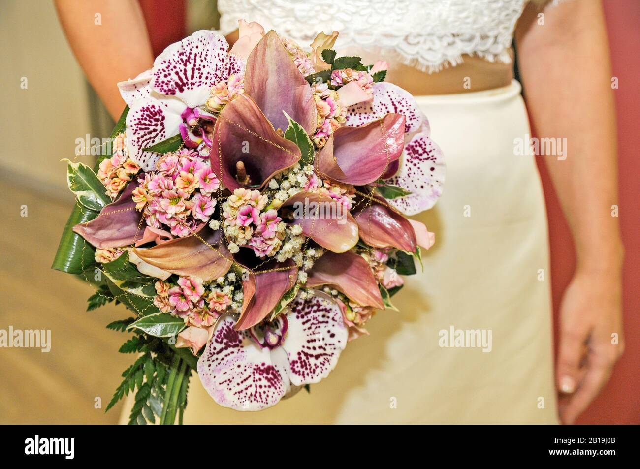 Colorful bouquet with anthuriums, gannet flowers and small florets ...