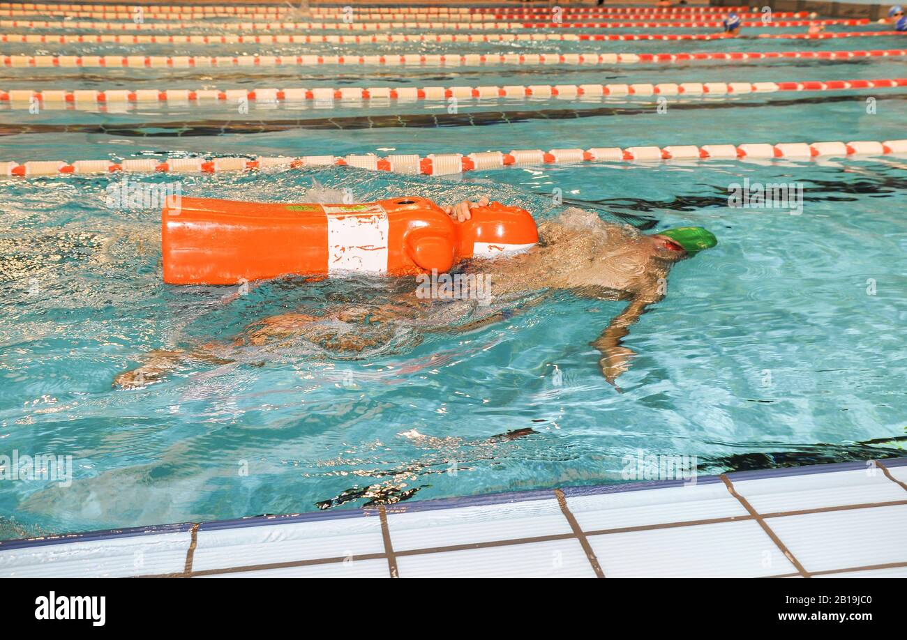 lifeguard training with rescue dummy in a pool Stock Photo - Alamy