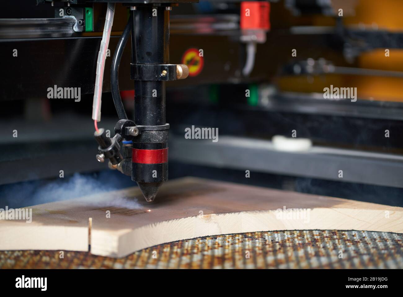 Computer cnc machine prent on wooden board in workshop, close-up Stock ...