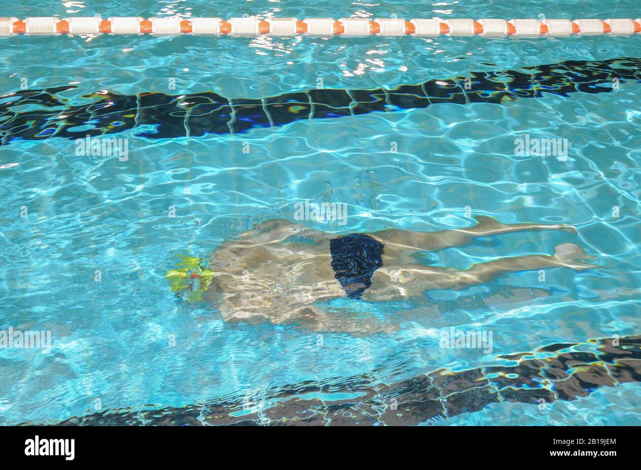 Swimmer, man swimming underwater in a pool Stock Photo - Alamy