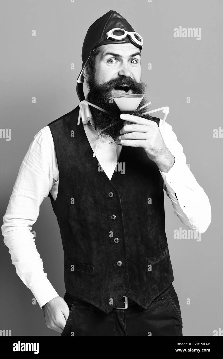 handsome bearded pilot or aviator man with long beard and mustache on ...