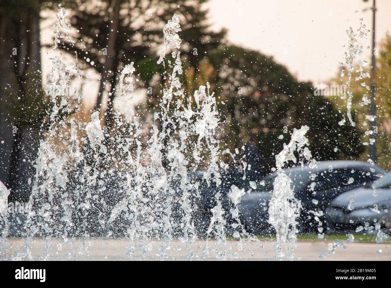A water fountain sprinkling water in the view Stock Photo - Alamy