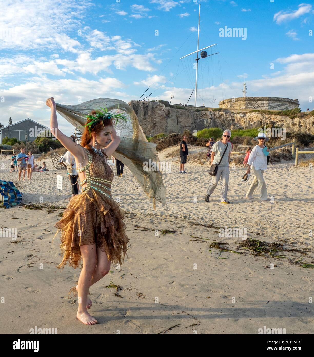 Woman cosplay costume dressed as a fairy walking on the sand at Bathers ...