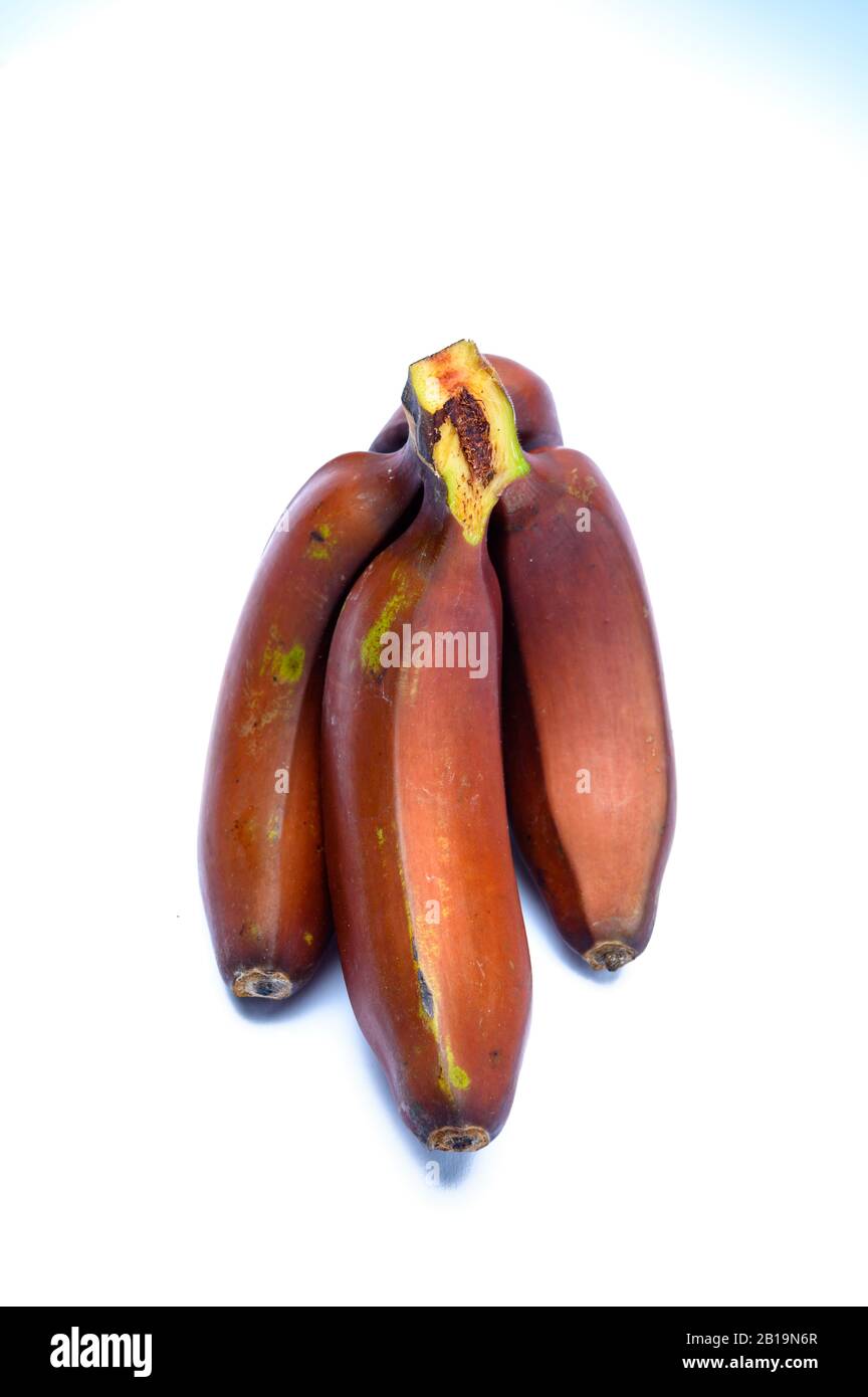 Bunch of ripe red bananas close up isolated Stock Photo - Alamy