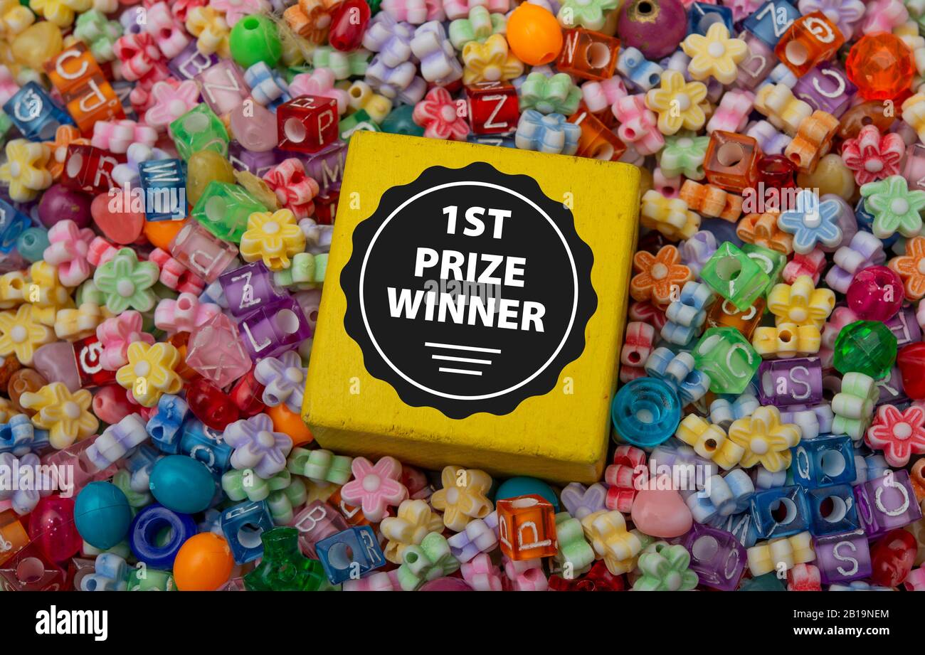 Text of 1st prize winner on gift box with multi-color of kids toys ...