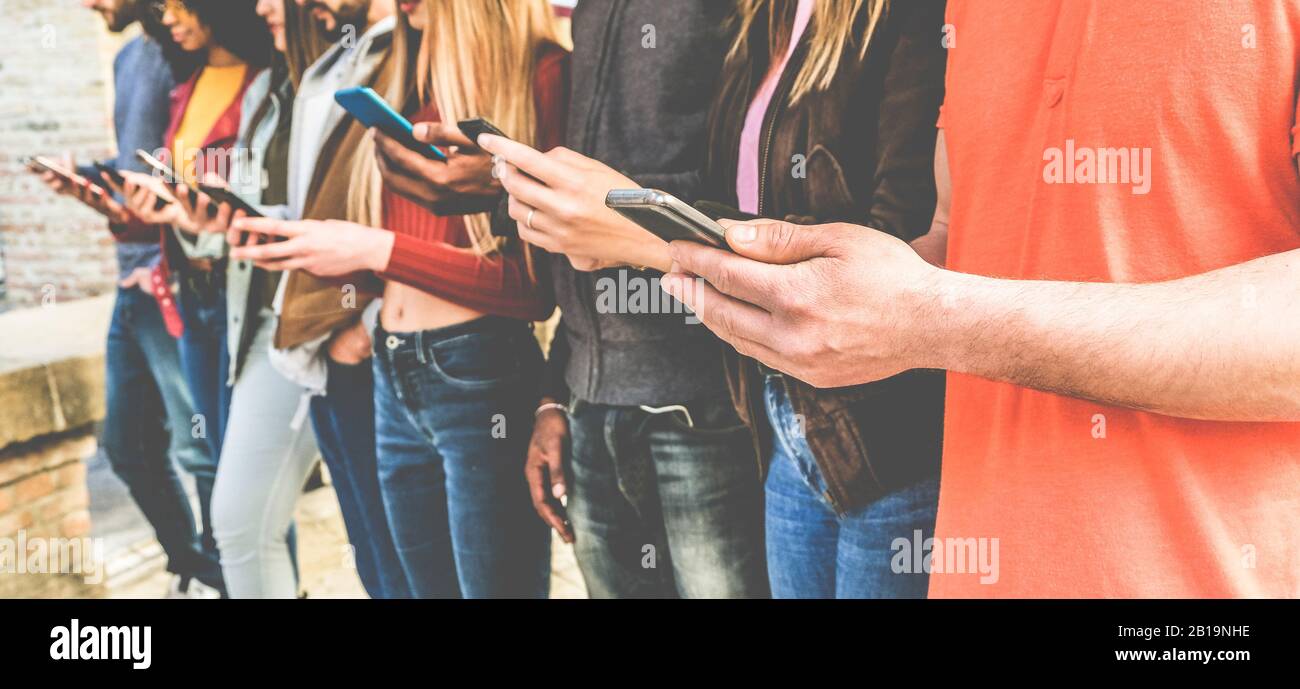 Young friends watching videos on smartphones - Millennials generation ...