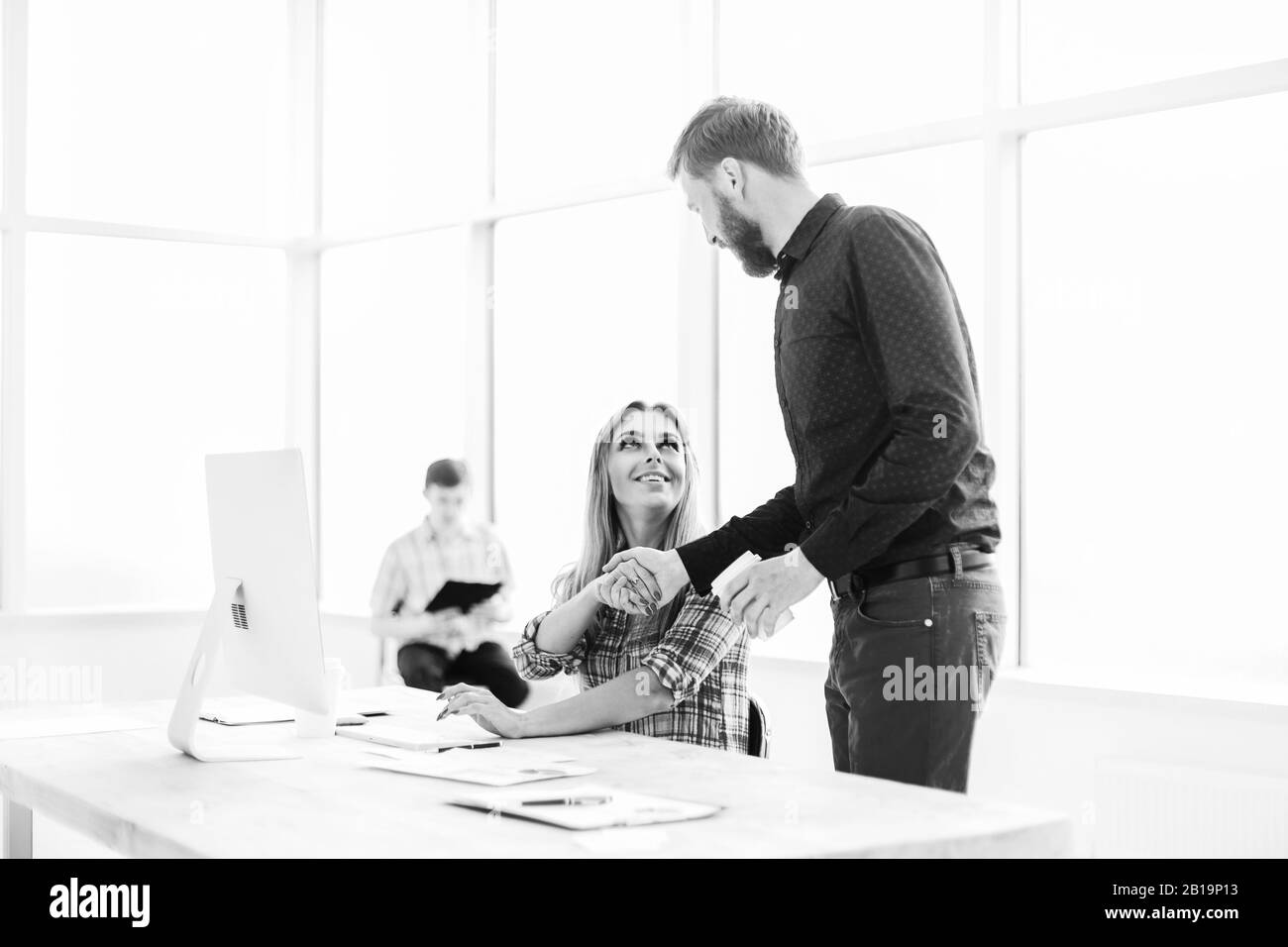 Manager and employee greeting each other in the workplace Stock Photo ...