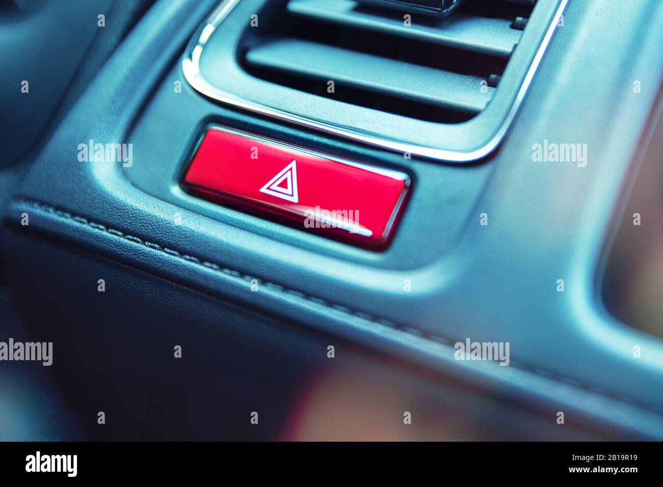 Close-up to emergency light button in car Stock Photo - Alamy