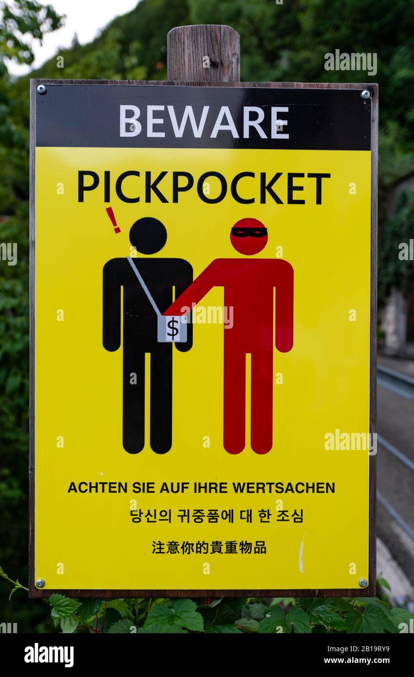 Warning against pickpockets, sign with Asian characters, Hallstatt ...