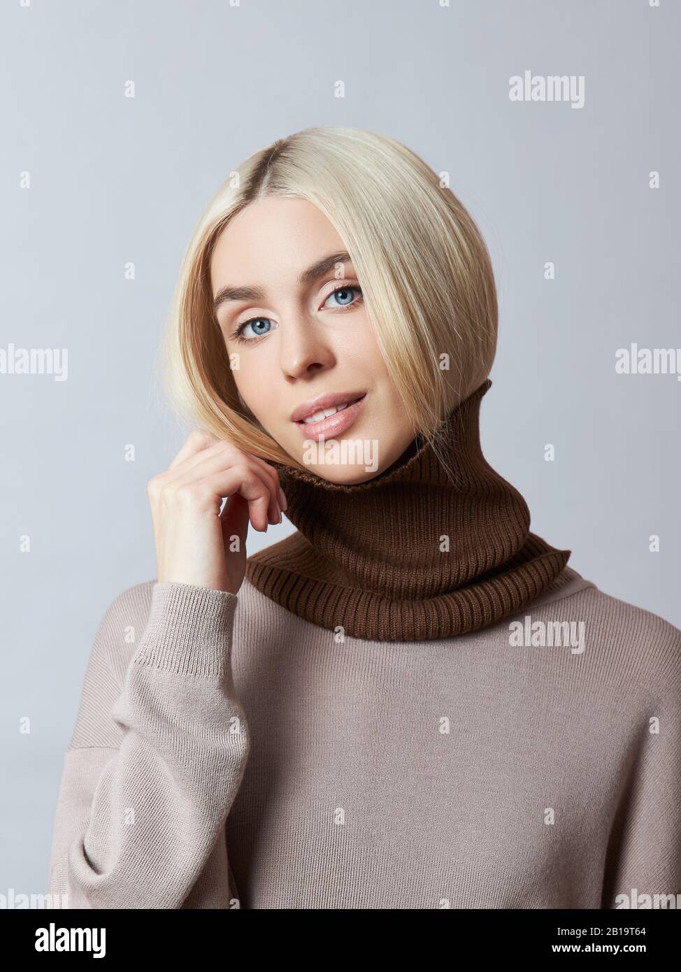 Beautiful blonde woman with a Snood Scarf around her neck. Girl in ...