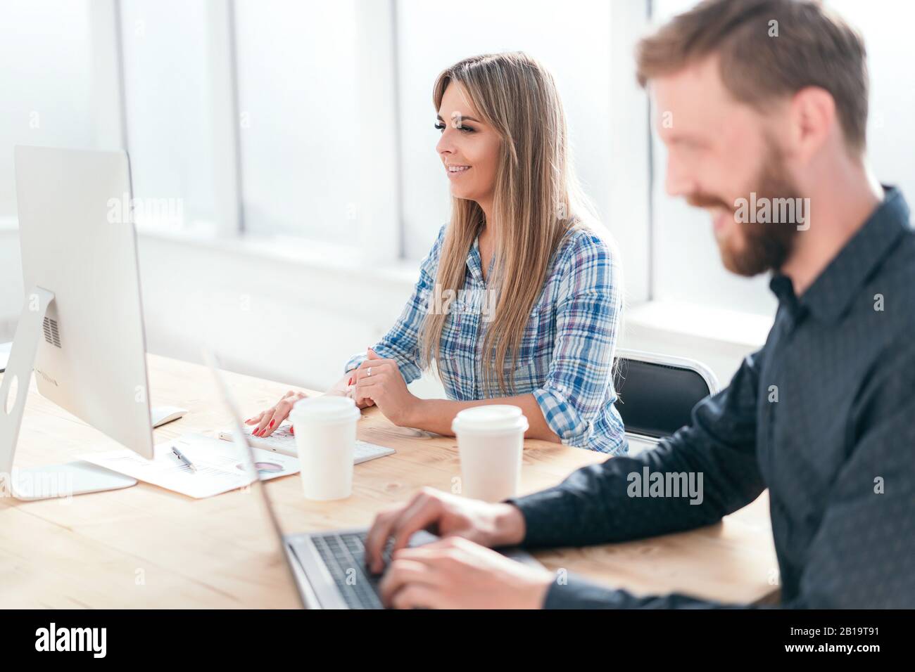 employees in the workplace in a modern office Stock Photo - Alamy
