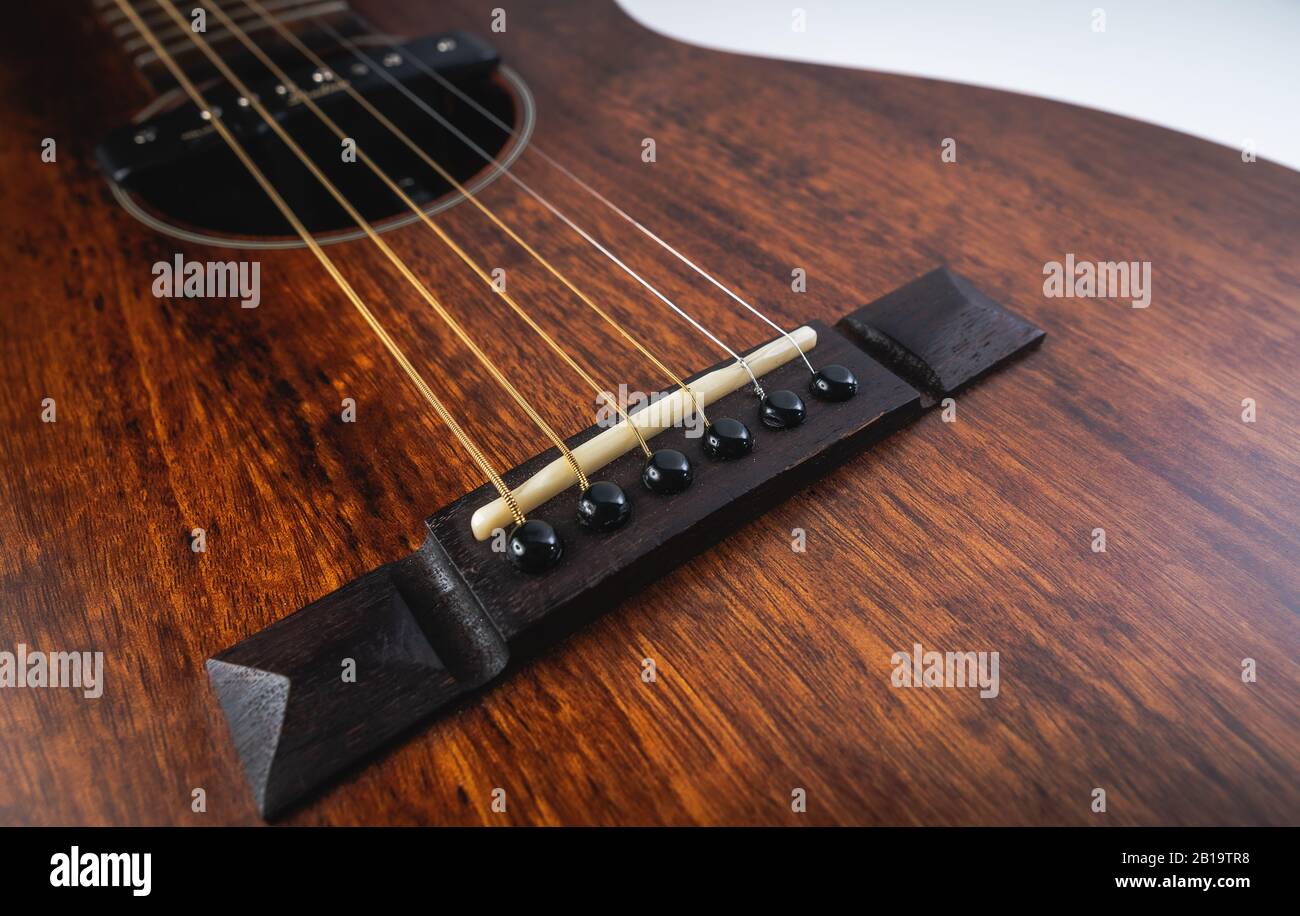 Brown acoustic guitar body with strings Stock Photo - Alamy