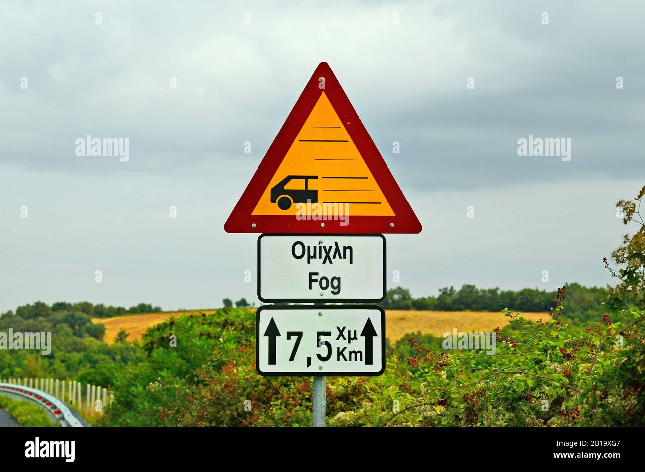 Greece, warning sign for fog area Stock Photo - Alamy