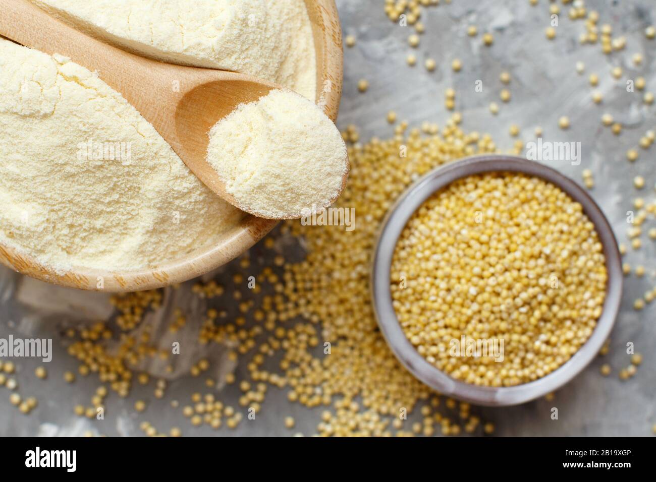Hulled millet flour and grain top view on a gray background Stock Photo ...