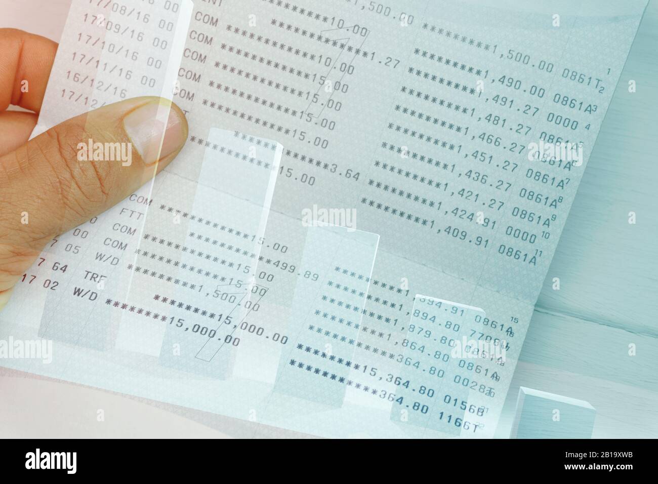 Top view of man hand coins statement book bank account of double ...