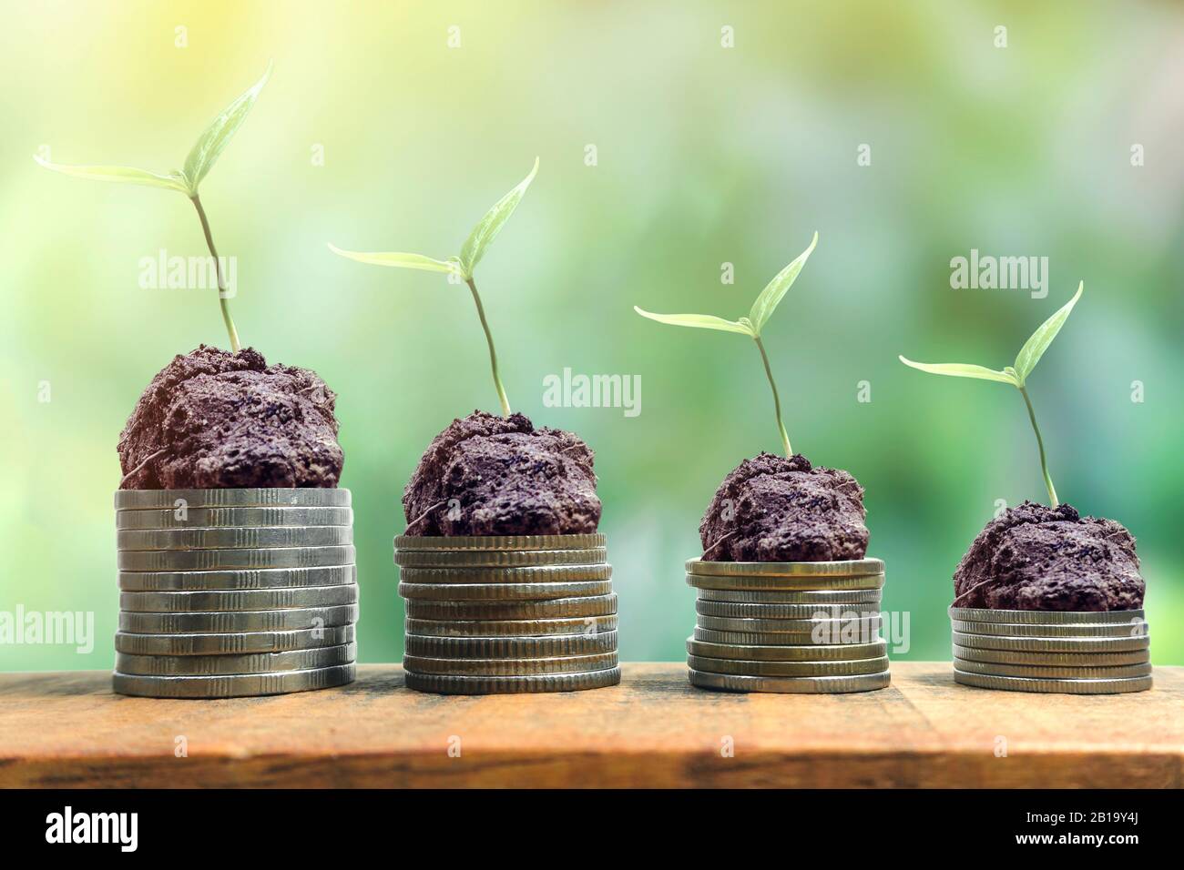Money growing concept trees growing on pile of coins money interest ...