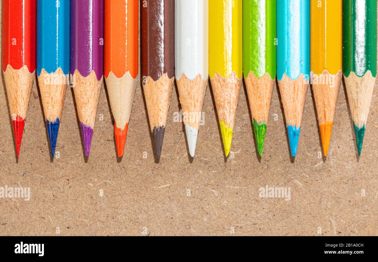 Wooden color pencils on a wooden background. Creativity and drawing ...