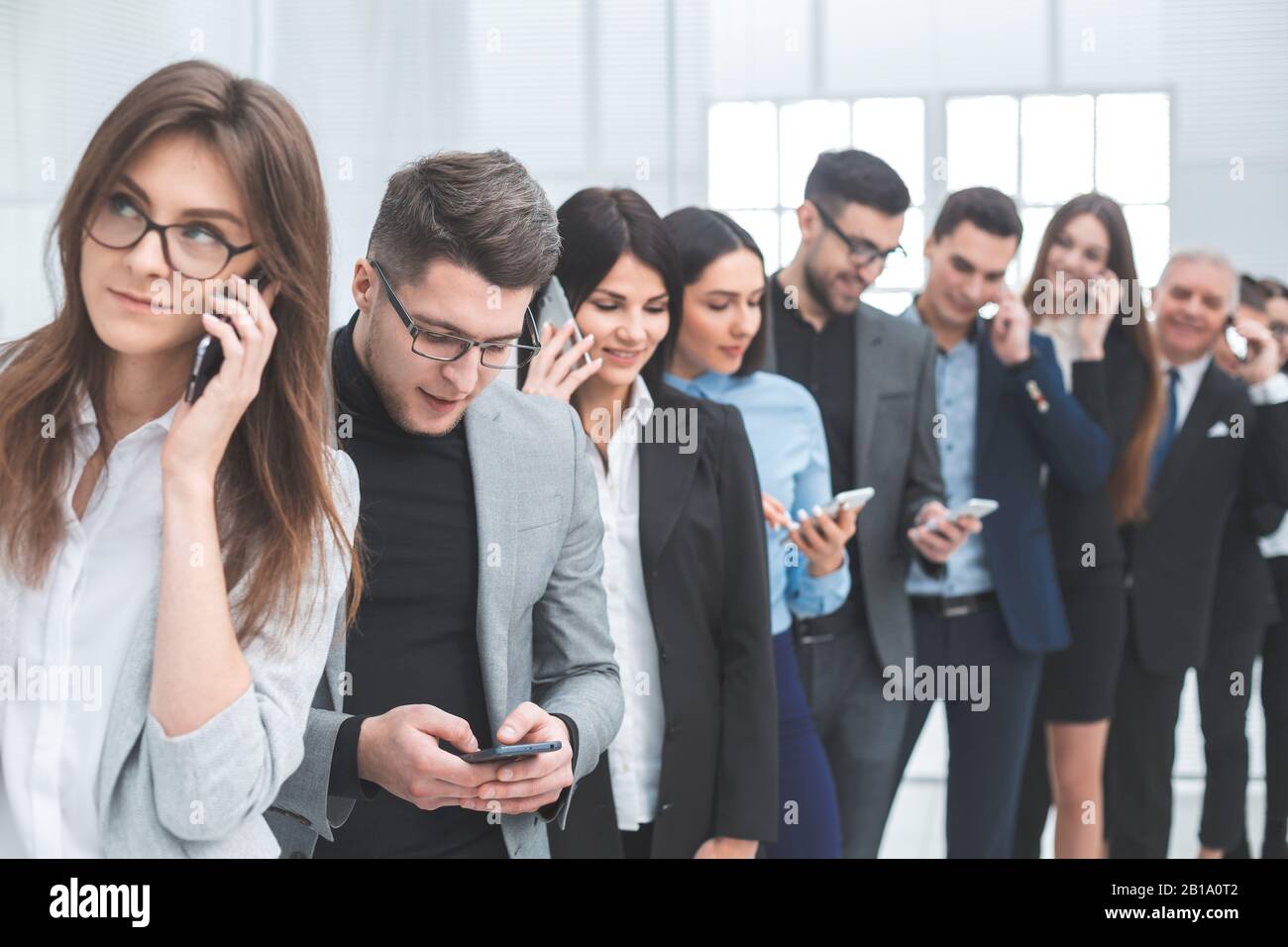 group of diverse young people use their smartphones Stock Photo - Alamy