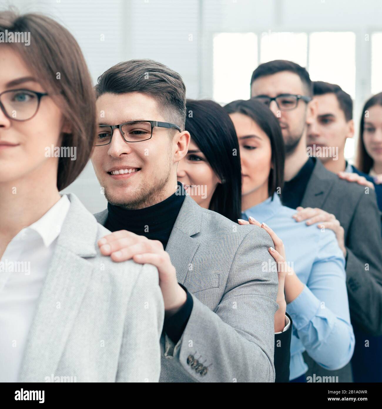 group of young business people standing behind each other Stock Photo ...