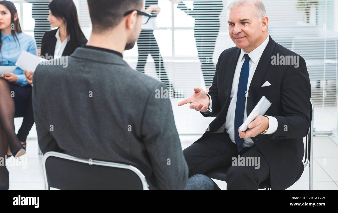 business man explaining something to his colleague Stock Photo - Alamy