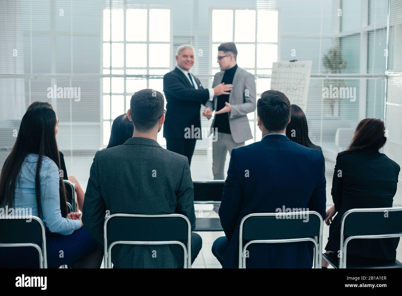 Manager is introducing a new employee of the company Stock Photo - Alamy
