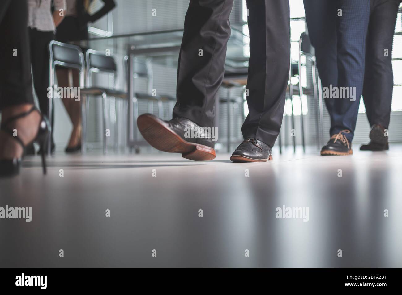 close up. group of employees leaving the workplace Stock Photo - Alamy