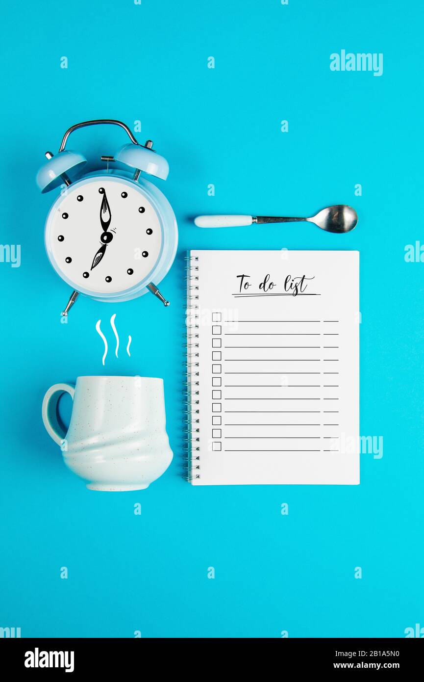 Coffee mug with clock and a To do list on a blue background Stock Photo ...